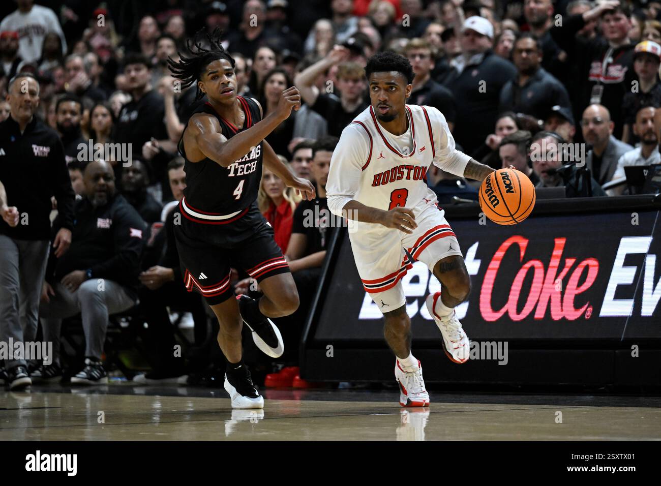 Houston guard Mylik Wilson (8) drives up court against Texas Tech guard ...