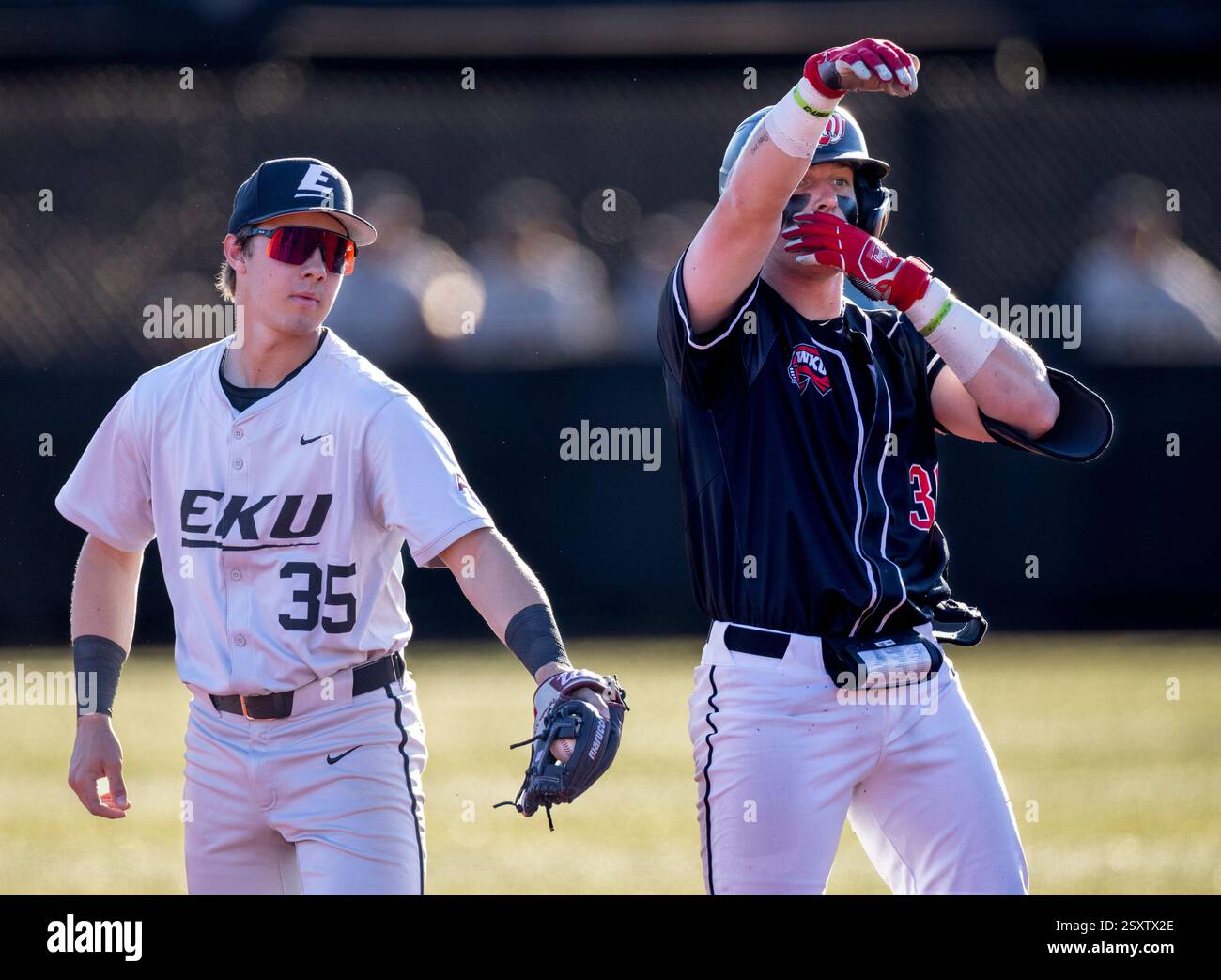 WKU first baseman Kyle Hayes (30) celebrates his double after beating ...