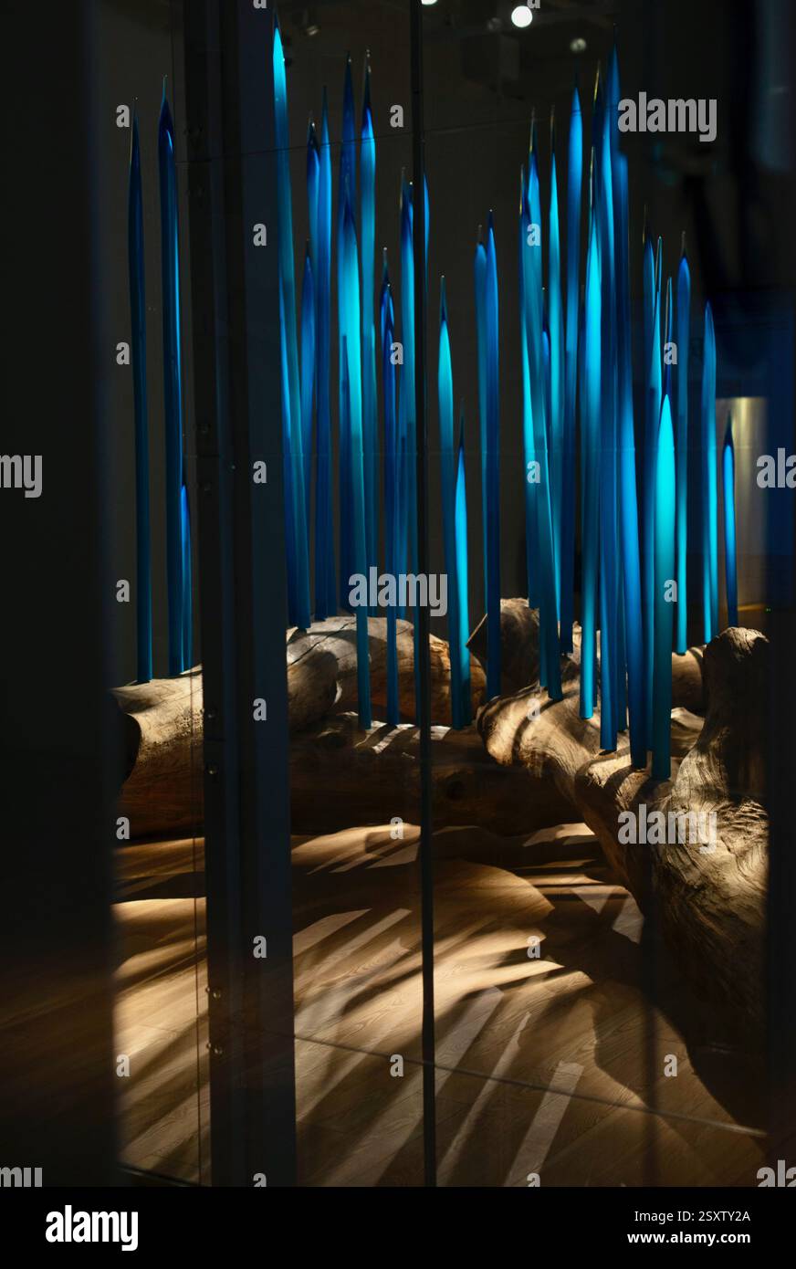 Visitors admire some of the glass art works on display inside the ...