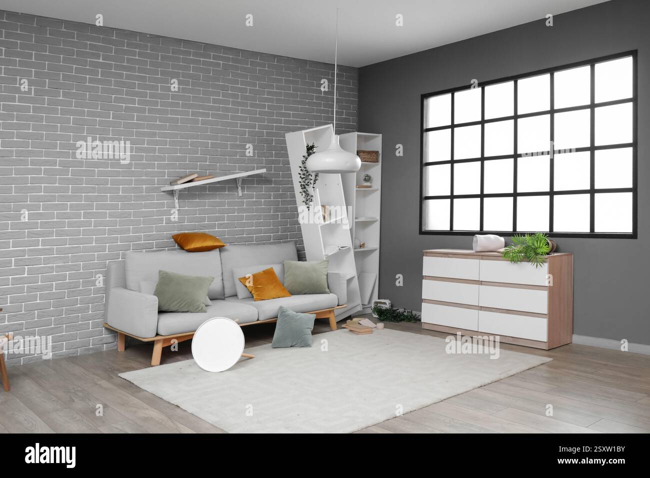 Interior of messy living room with overturned furniture after ...