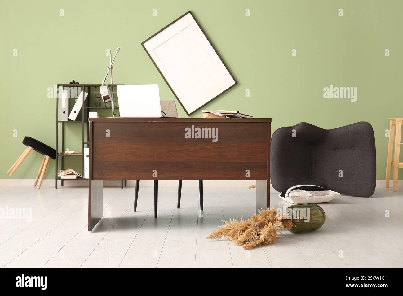 Interior of damaged office with armchair and workplace after earthquake ...