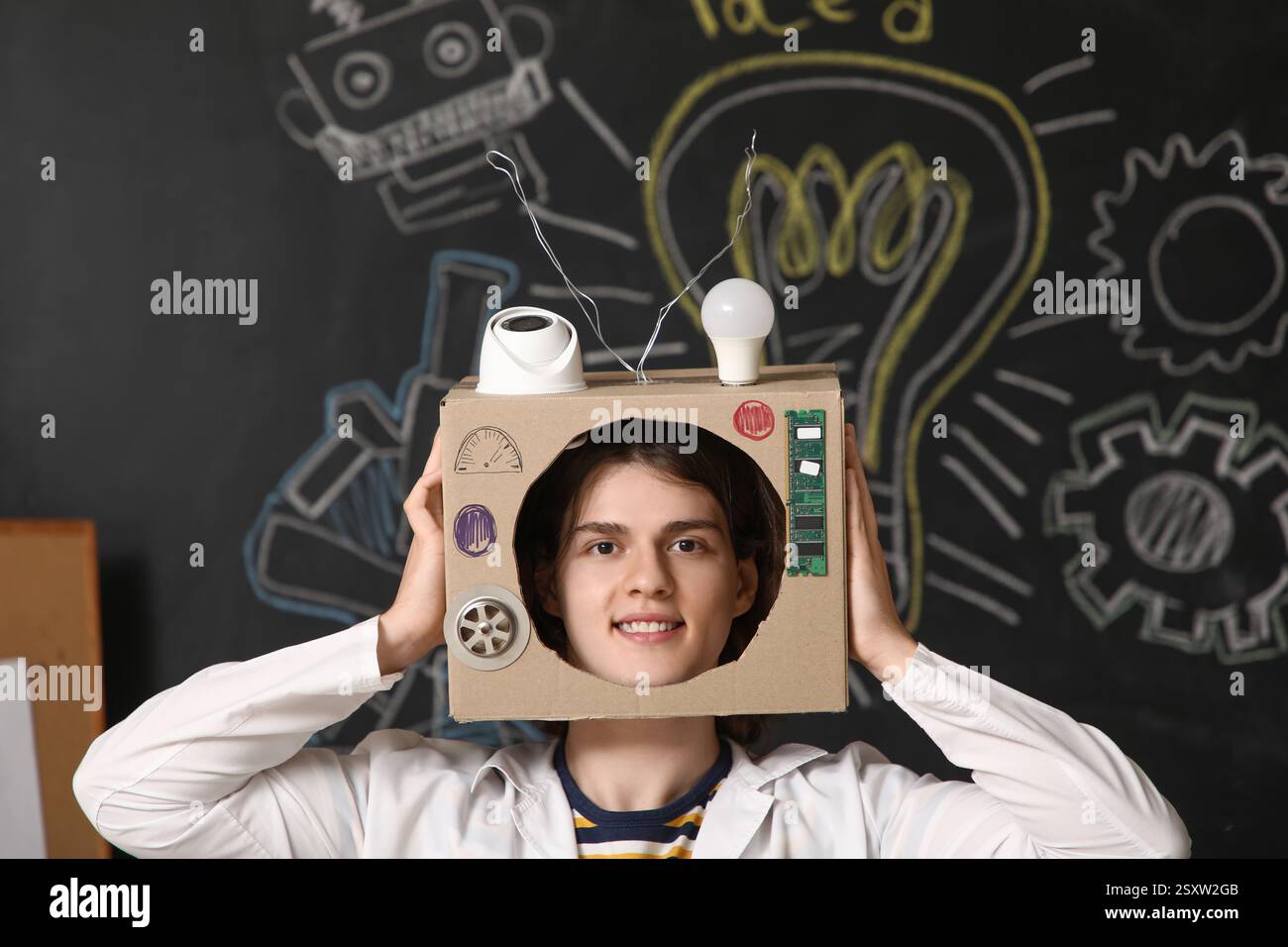 Male inventor with device in workshop Stock Photo - Alamy