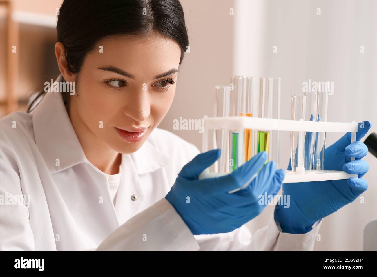 Female inventor with test tubes in laboratory, closeup Stock Photo - Alamy