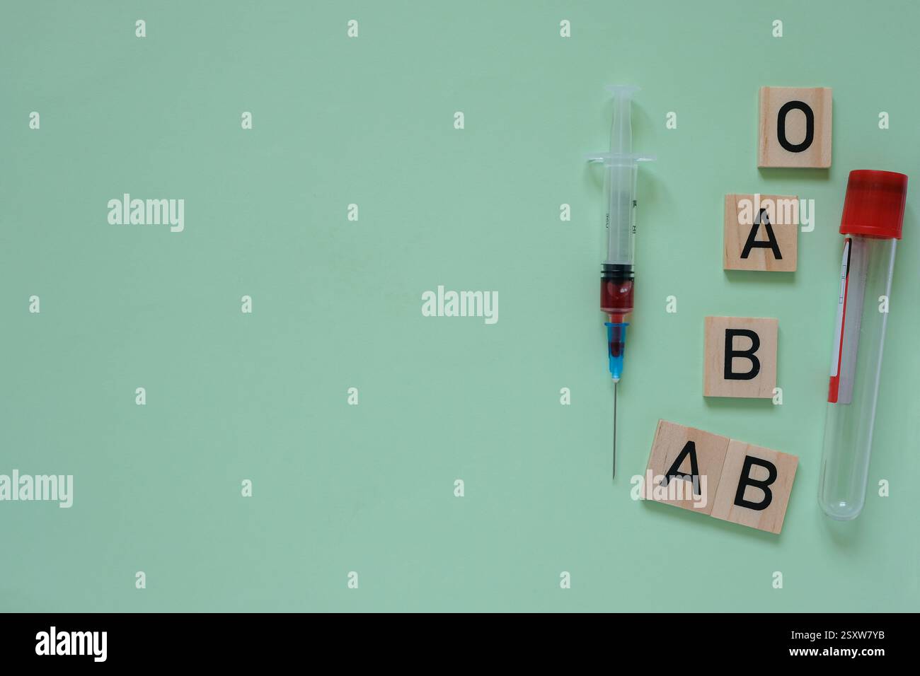 Test tubes with red and purple plugs. Wooden cubes with letters ...