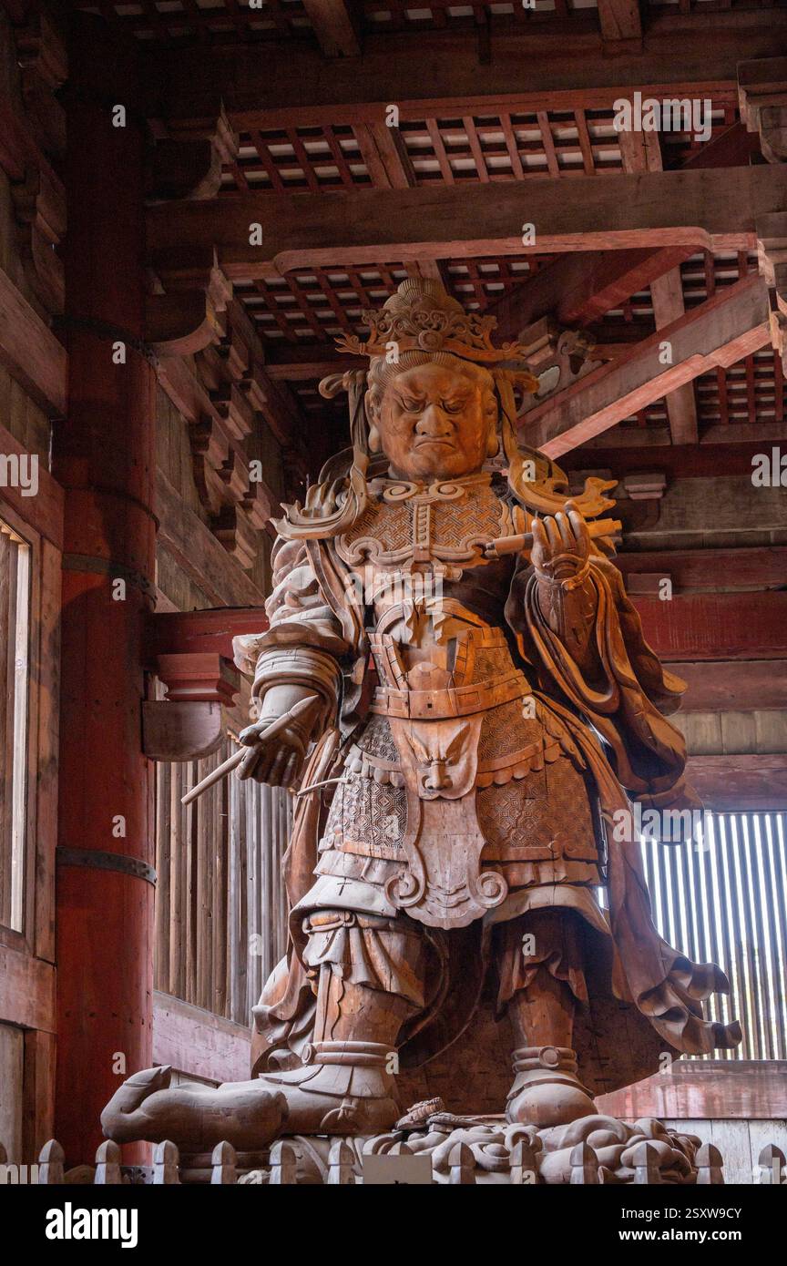 View of a guardian deity statue inside the Todaiji Temple complex in ...