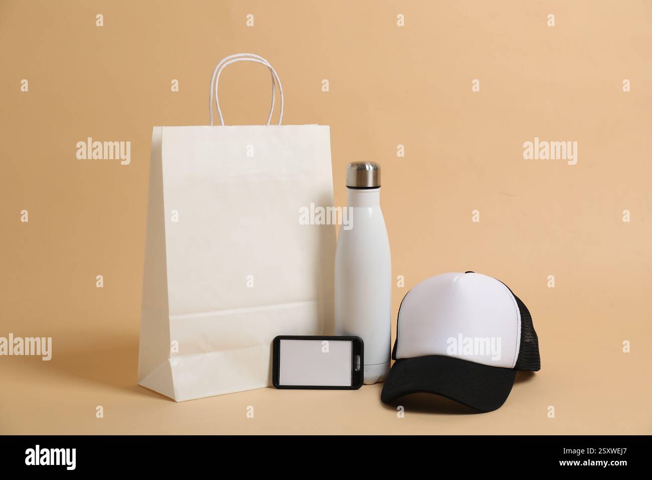 Different blank items for branding on beige background. Mockup for ...