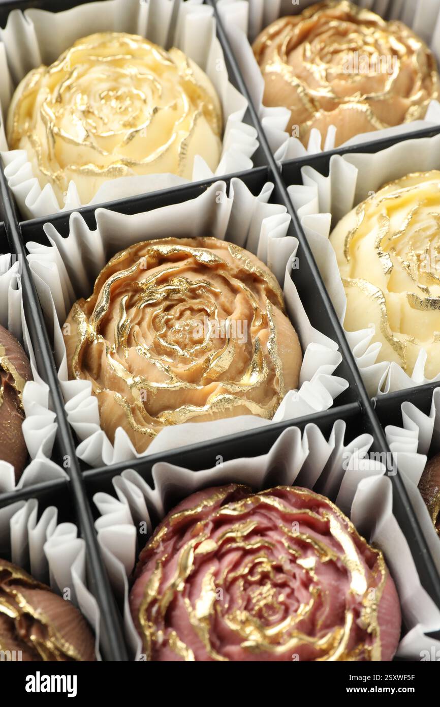 Flower shaped chocolate bonbons in box, closeup Stock Photo - Alamy