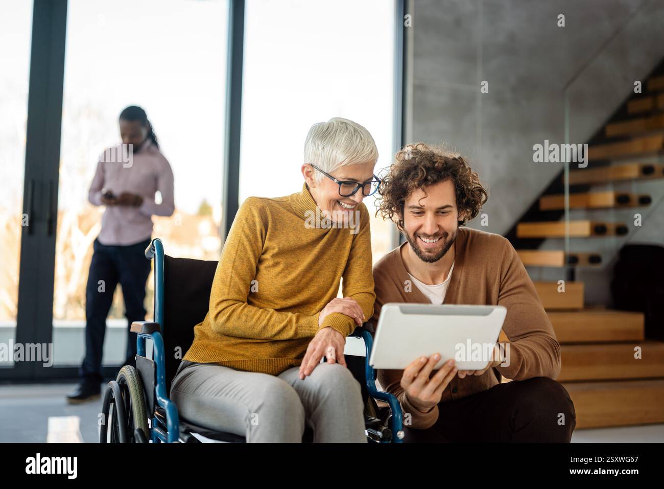 The image includes a person using a wheelchair, depicting inclusivity ...