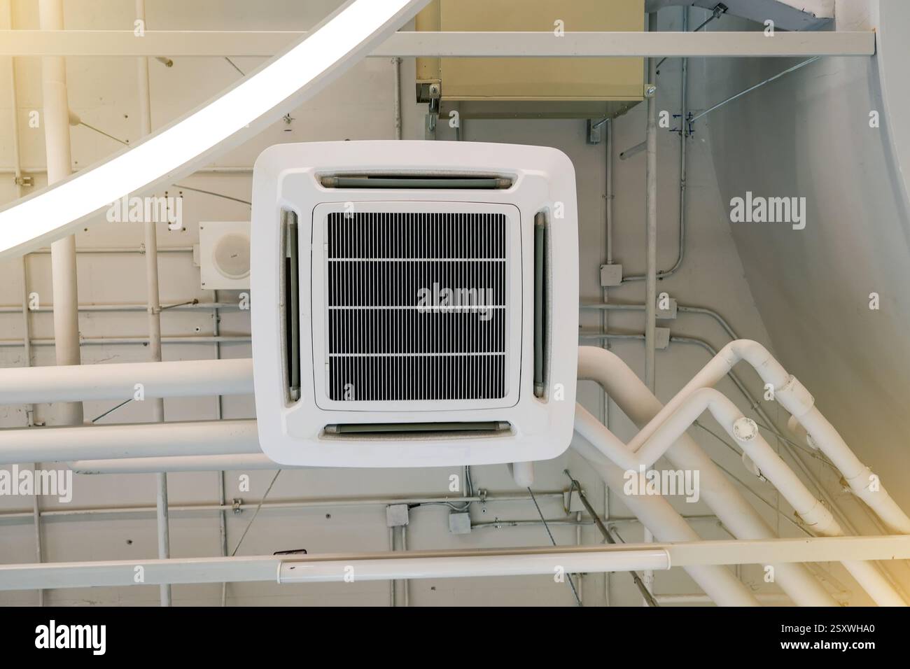 A ceiling-mounted air conditioning unit is showcased in a bright ...