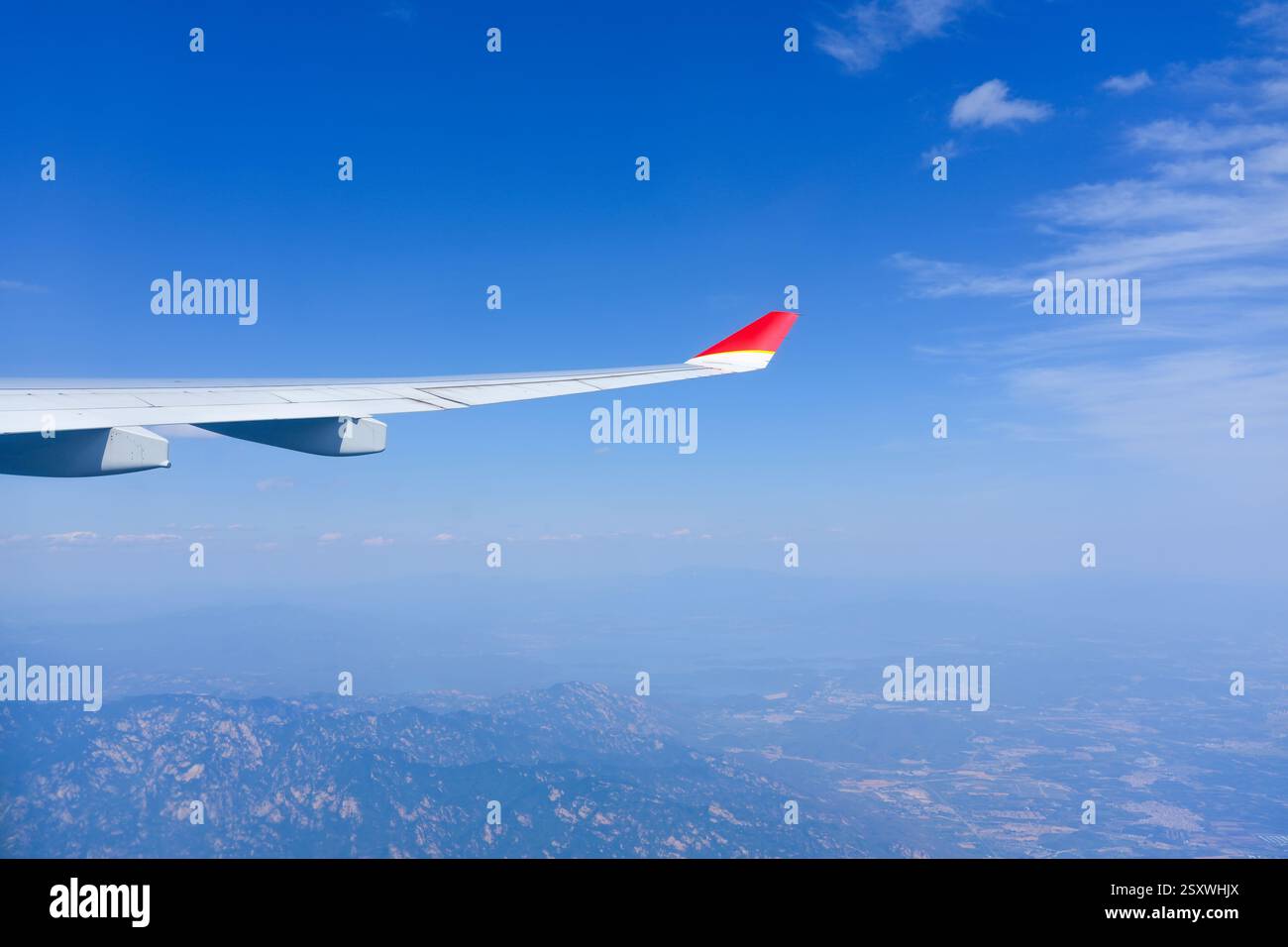 The view from the airplane window to the clouds and sunset. Airplane ...