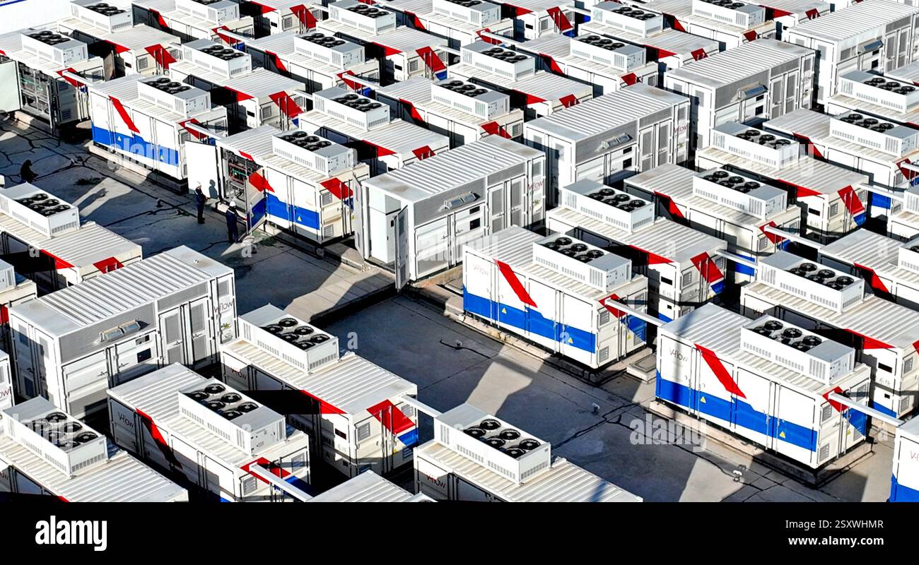 ZHANGYE, CHINA - FEBRUARY 25, 2025 - Technicians install and test ...