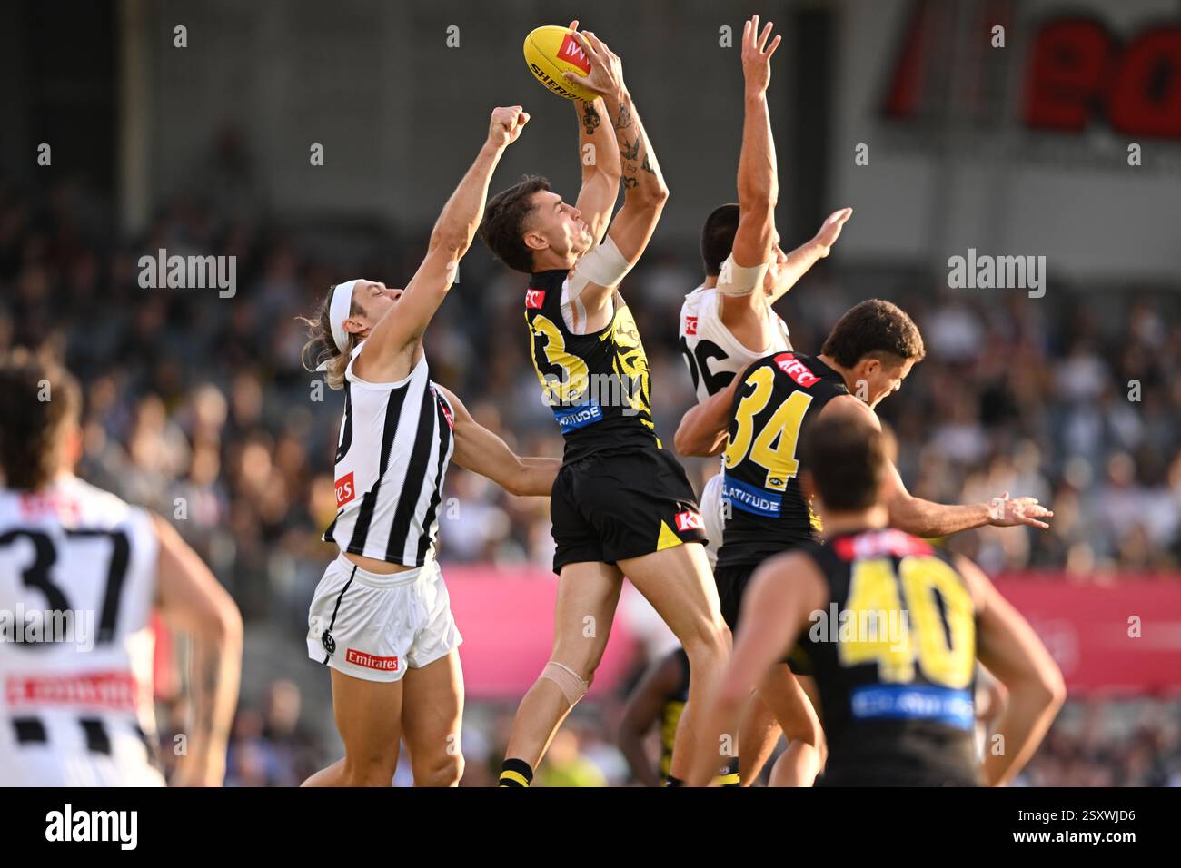 Melbourne, Australia. 26th Feb, 2025. Jacob Bauer of Richmond (centre ...