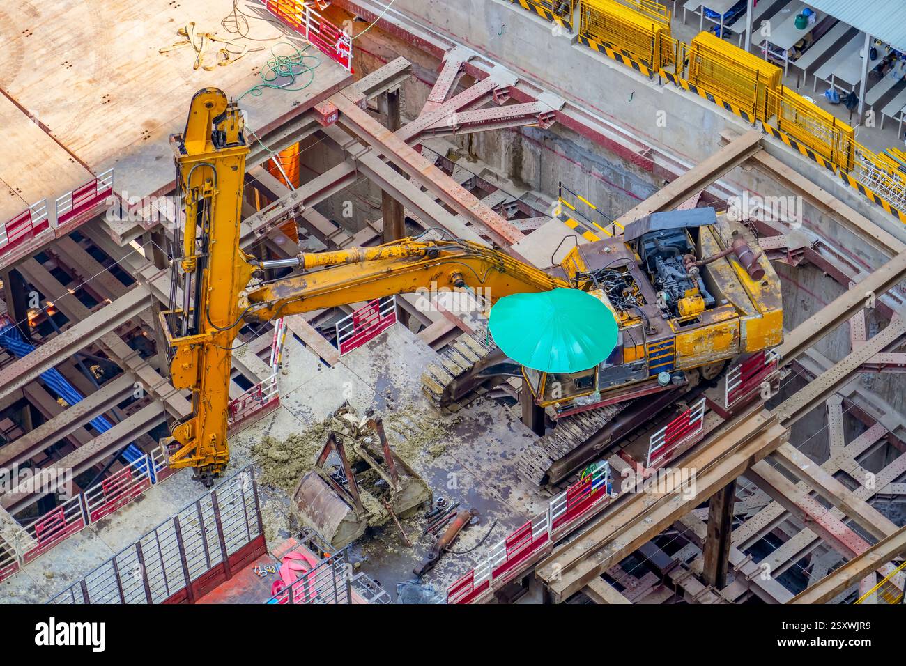 Digging excavator with extended boom for vertical pit foundation pit ...