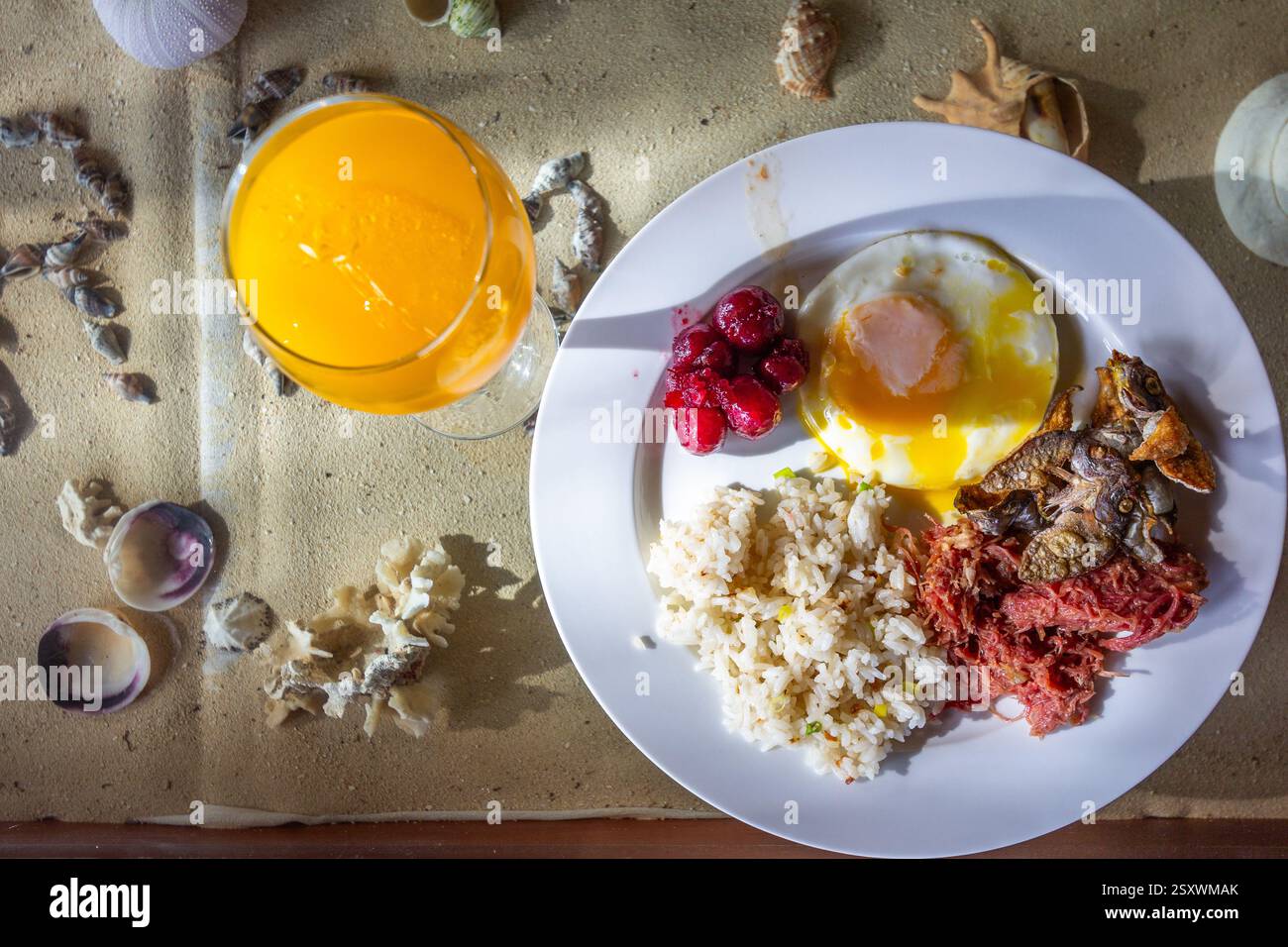 Typical Filipino rice breakfast with egg, dried fish, corned beef ...