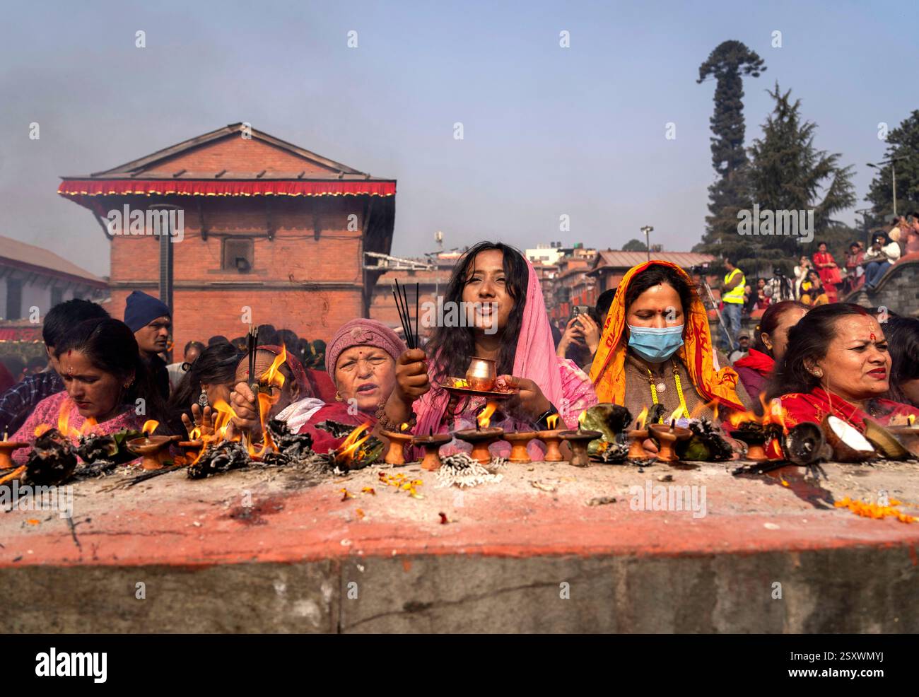 Devotees offer their prayers at the Pashupatinath Hindu temple during ...