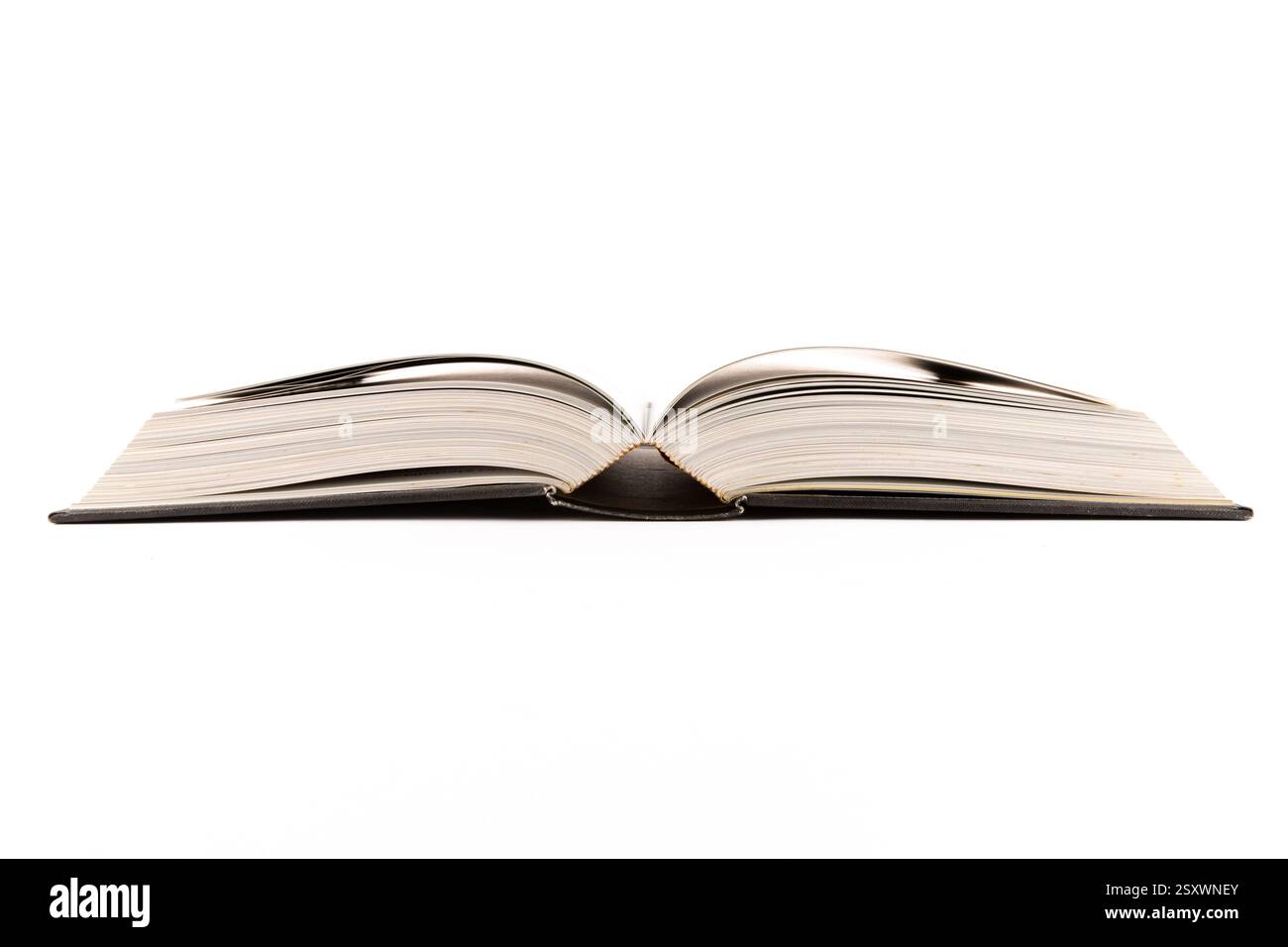 Open book laying flat isolated on white background Stock Photo - Alamy