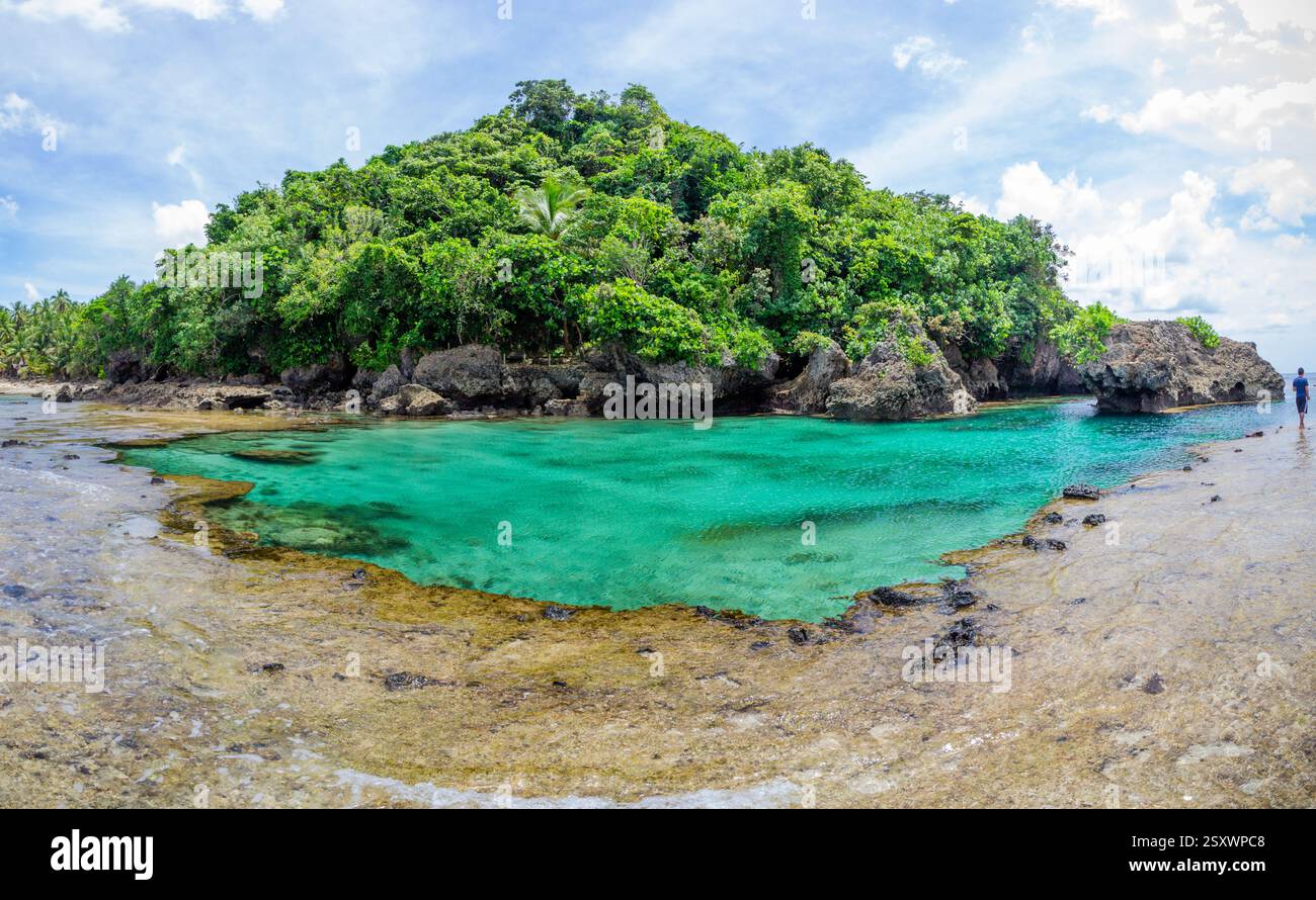 Stunning beach views at Magpupungko Rock Pool and Flats in Siargao, Philippines, a popular ...
