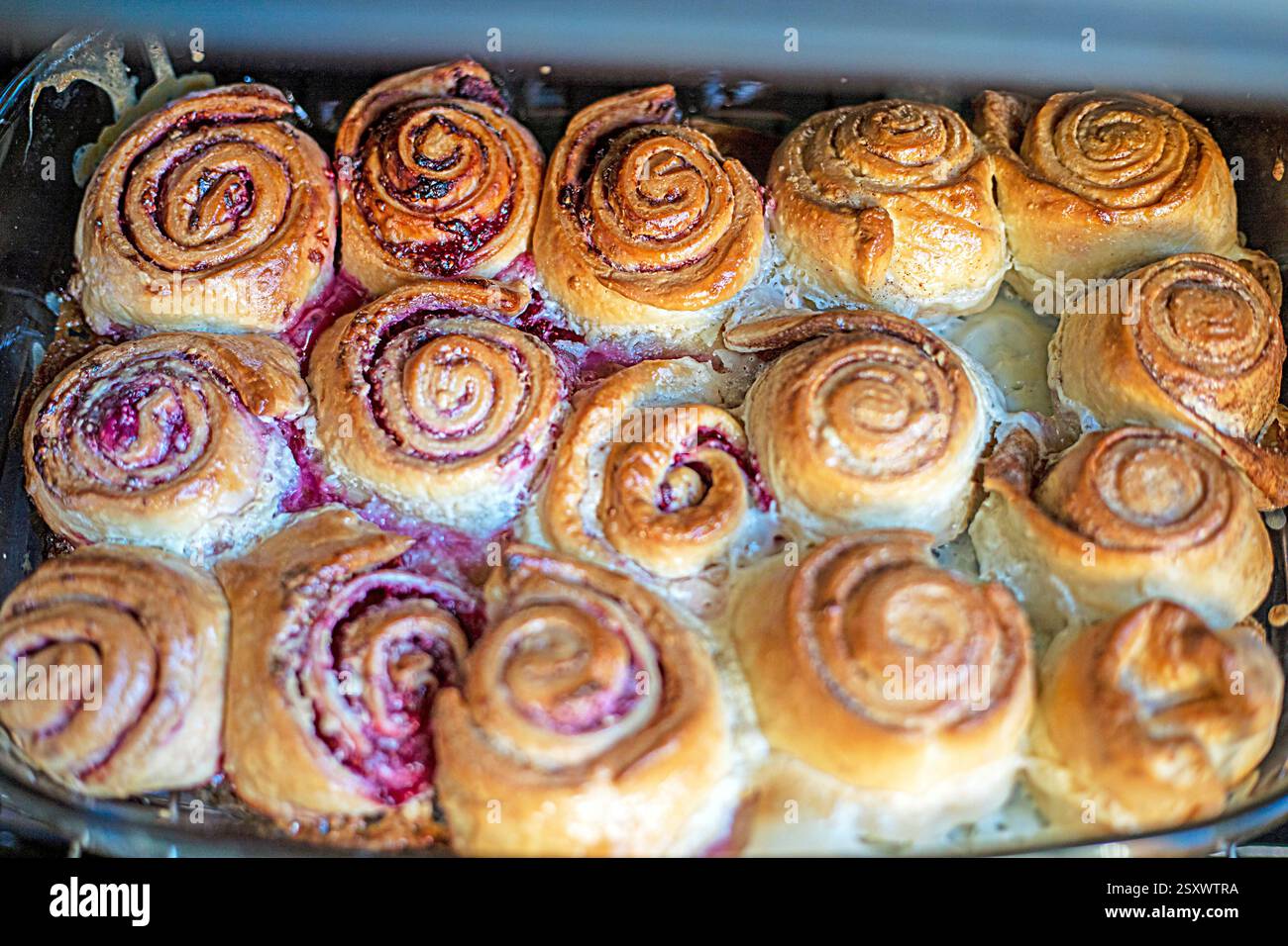 cooking raspberry and cinnamon rolls in mascarpone sweet and sour cream ...