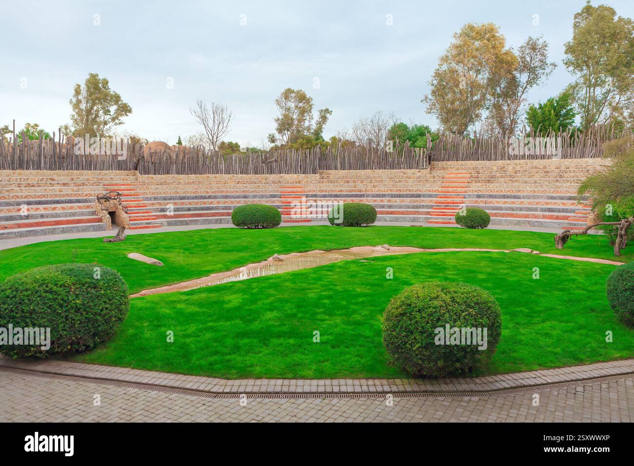 Outdoor amphitheater with tiered stone seating arranged in semi circle ...