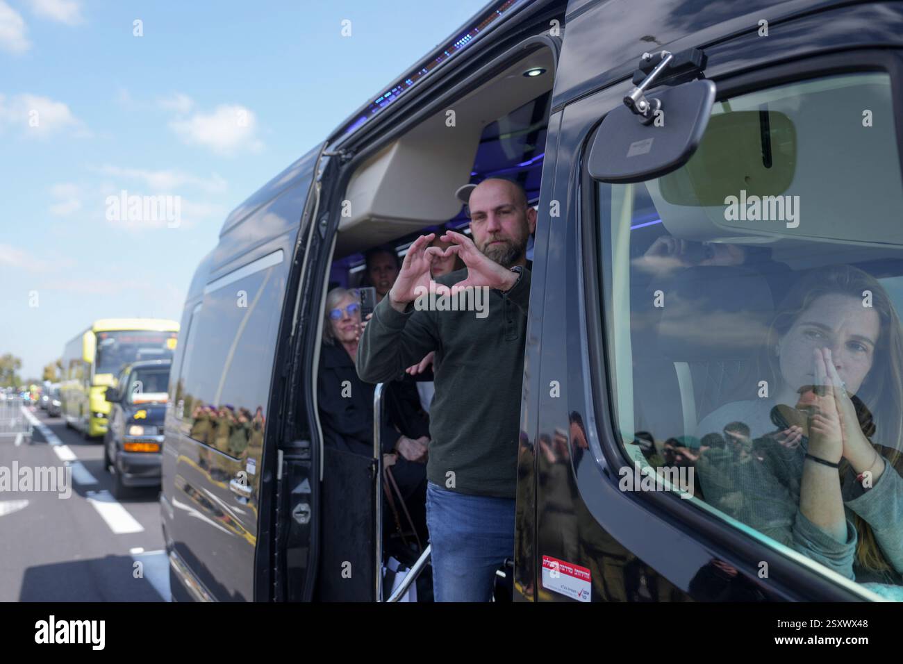 Relatives of Bibas family show their appreciation to the crowd on the ...