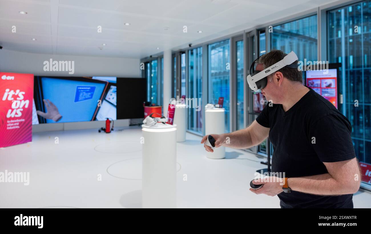 Essen, Germany. 26th Feb, 2025. An employee wearing virtual reality ...