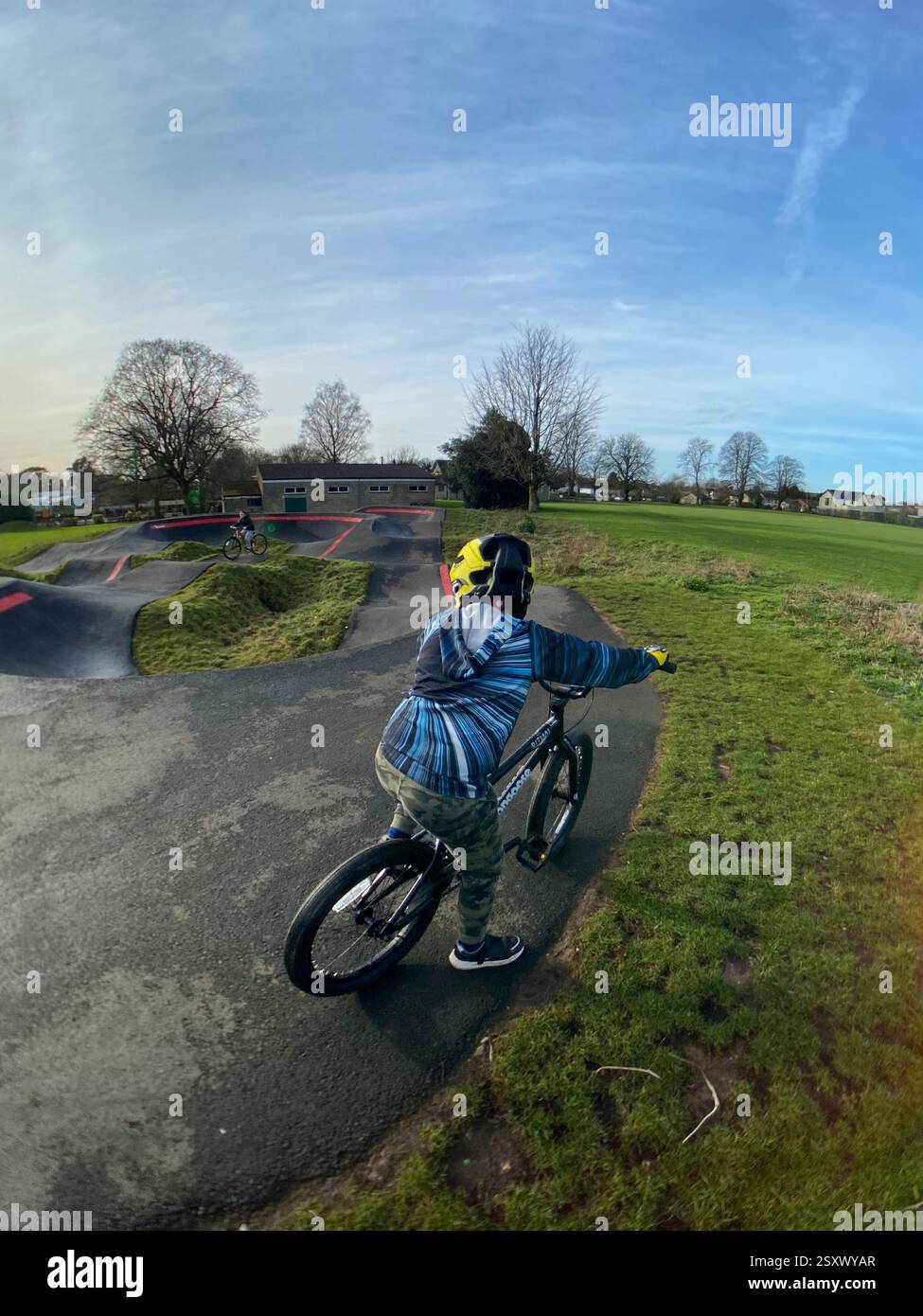 Children riding BMX’s at a cycle pump track Stock Photo - Alamy