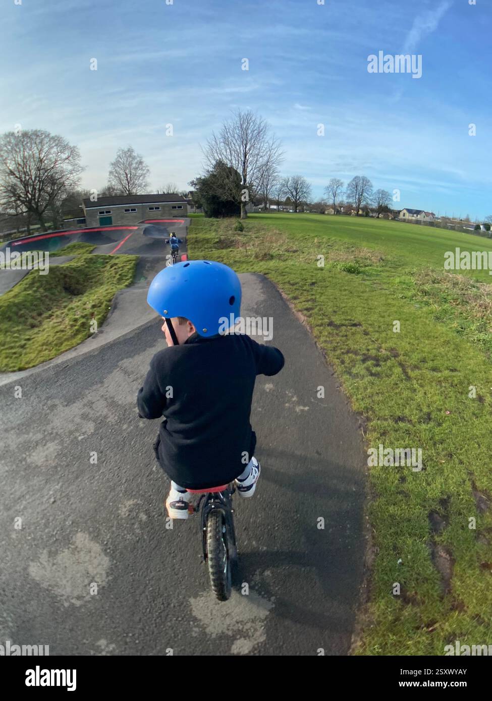 Children riding BMX’s at a cycle pump track Stock Photo - Alamy