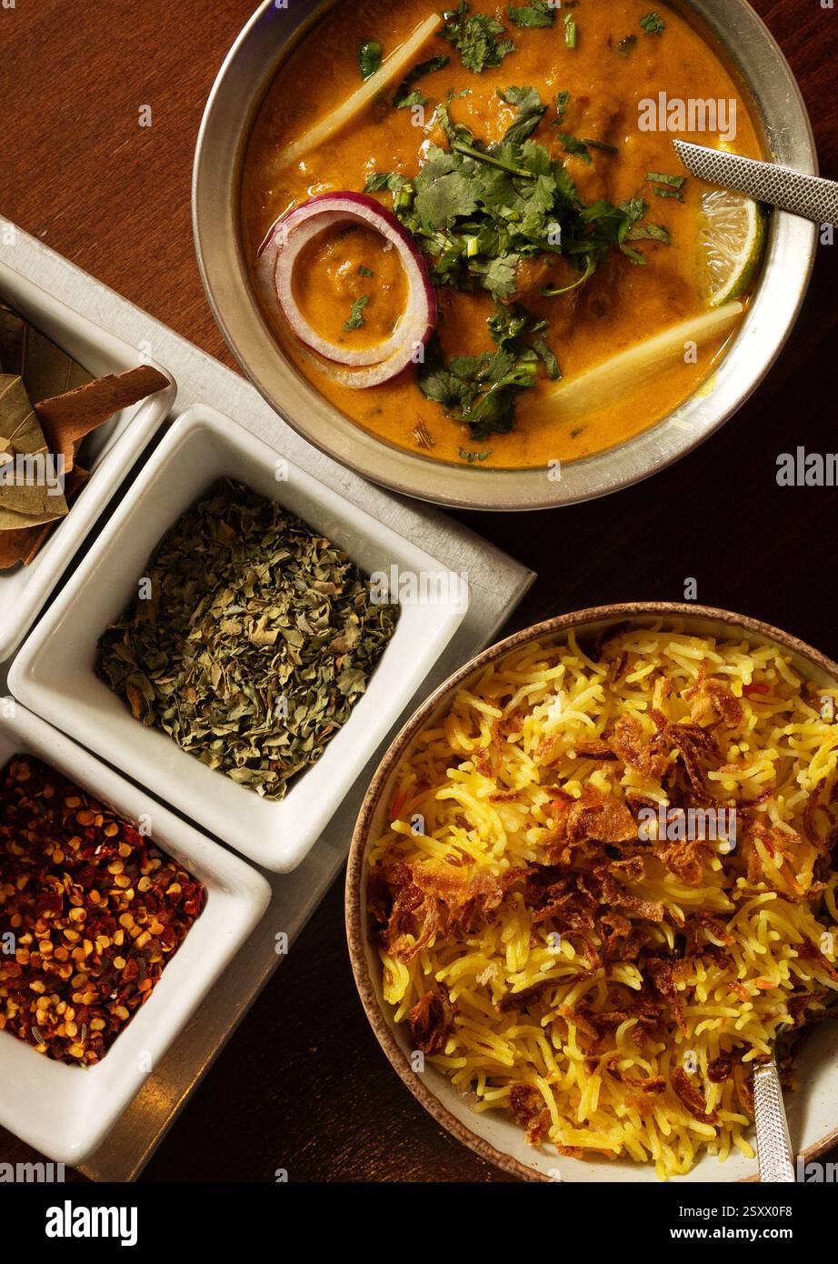 A selection of traditional indian food dishes with a selection of ...