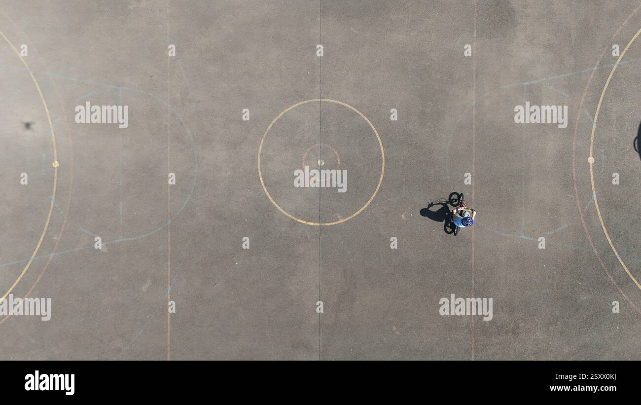Aerial Birds Eye view of children riding bicycles Stock Photo - Alamy