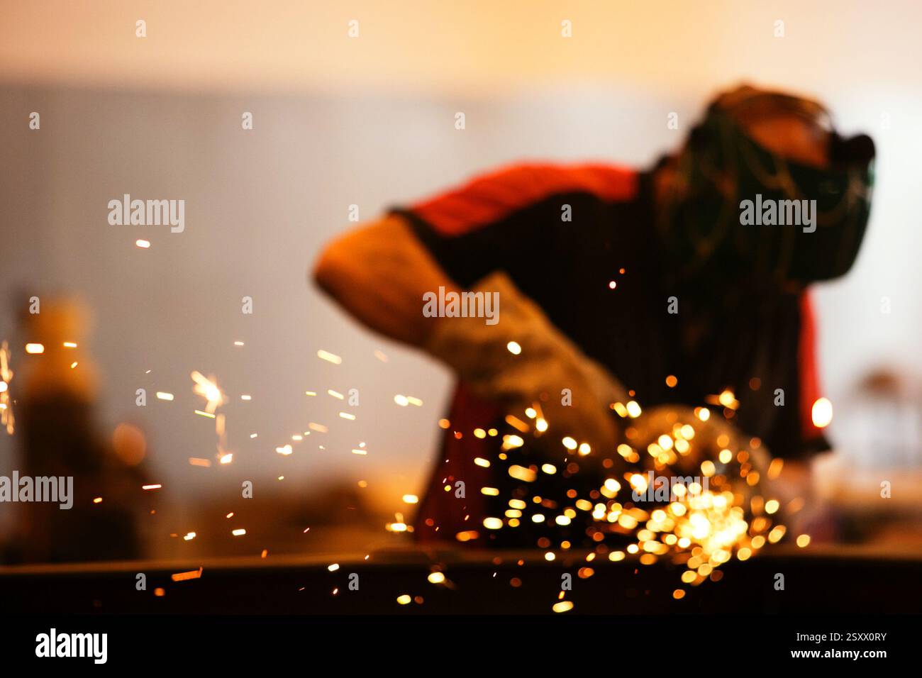 Industrial Worker Welding Metal With Spark Flying in a Manufacturing ...