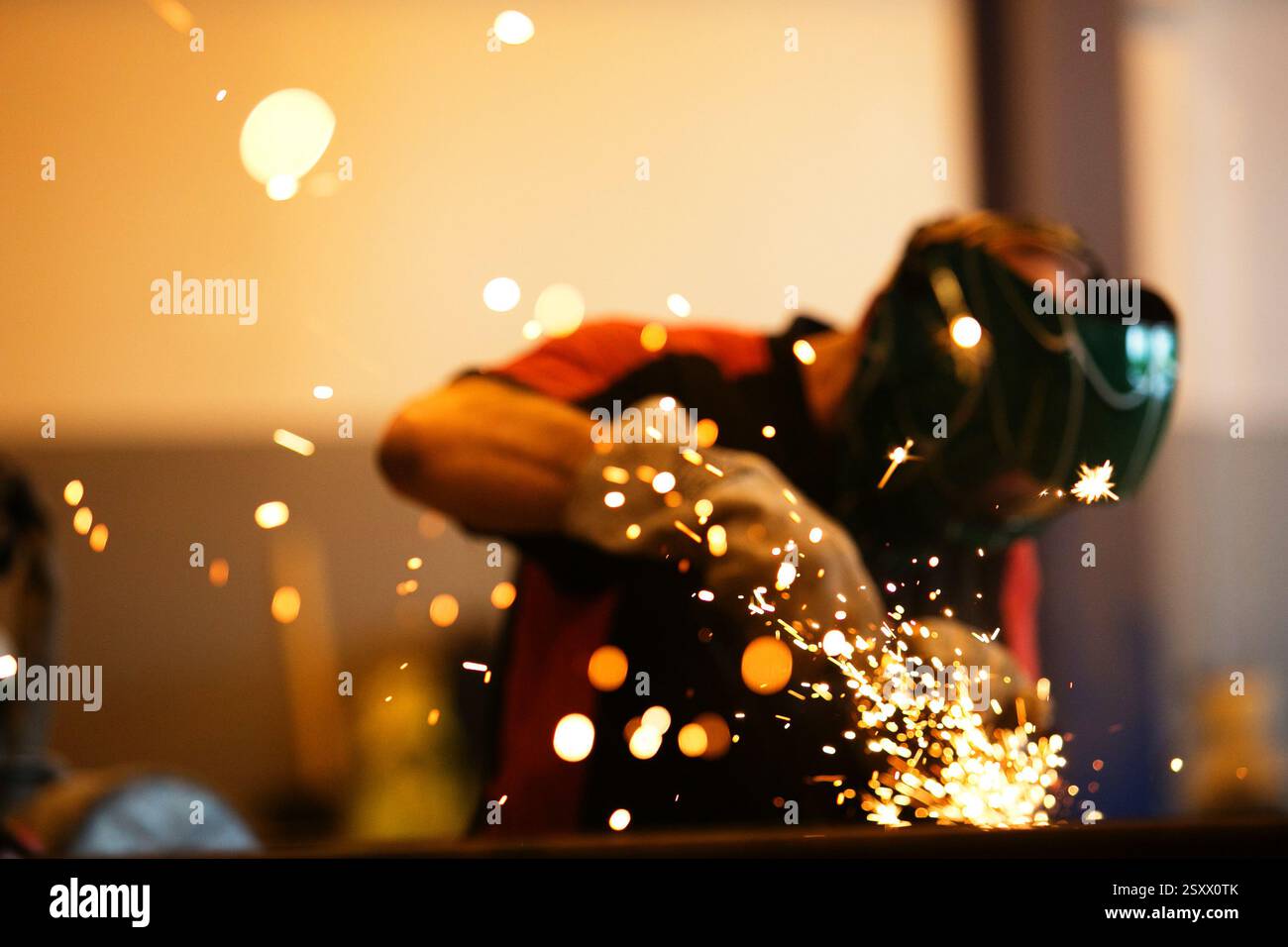Industrial Worker Welding Metal With Spark Flying in a Manufacturing ...