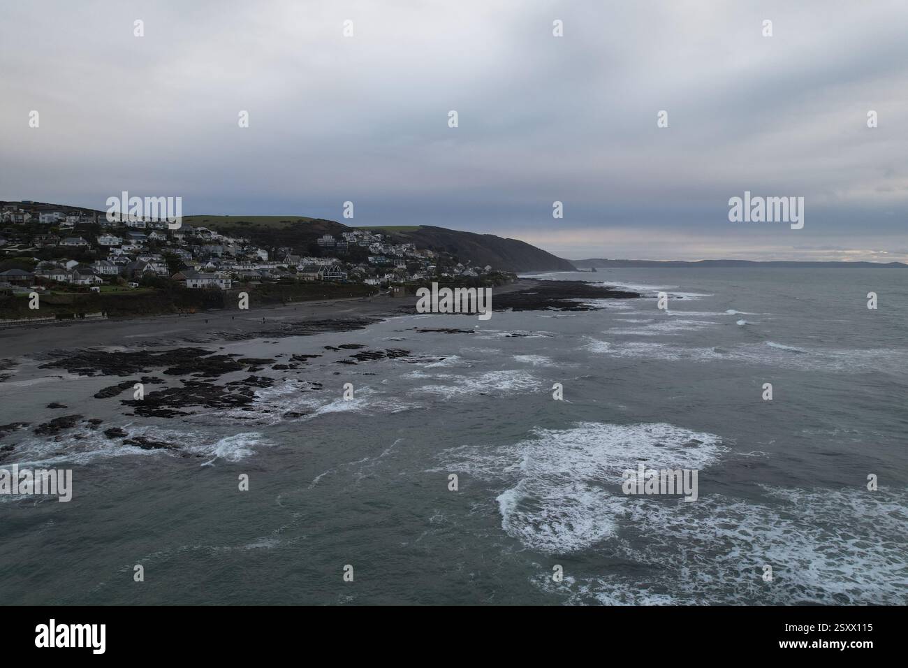 Aerial captures at the shoreline of Downderry beach in Cornwall UK ...