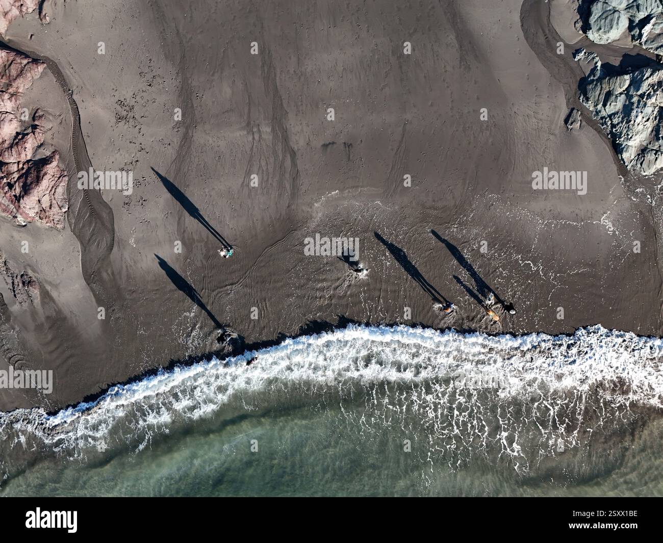 Aerial shoreline scene with casting shadows on the beach Stock Photo ...