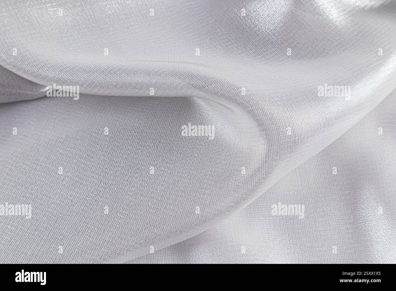 The texture of silk, chiffon transparent fabric is silver colored ...