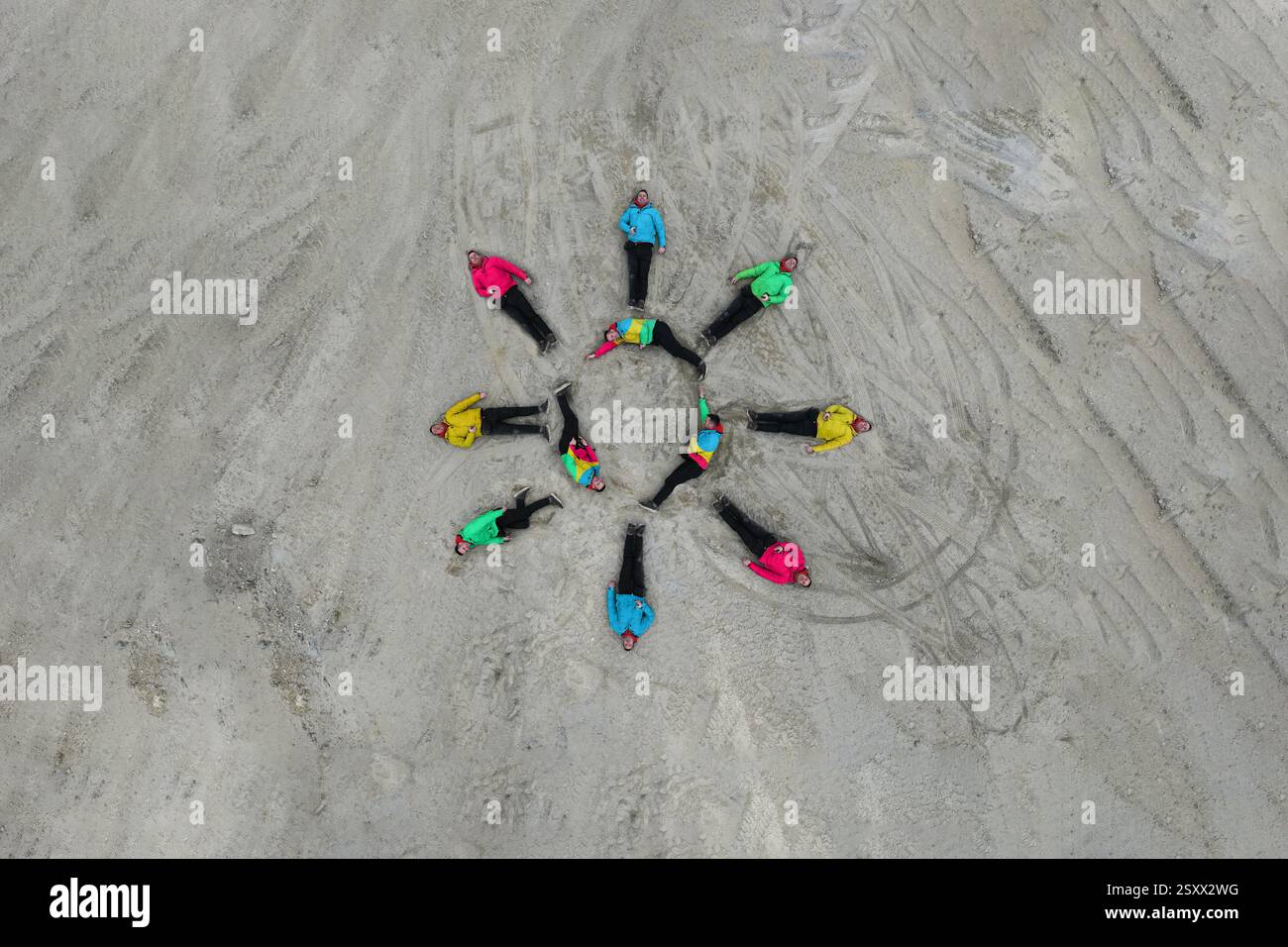 Vibrant top down aerial photo of a man laying down forming a ...