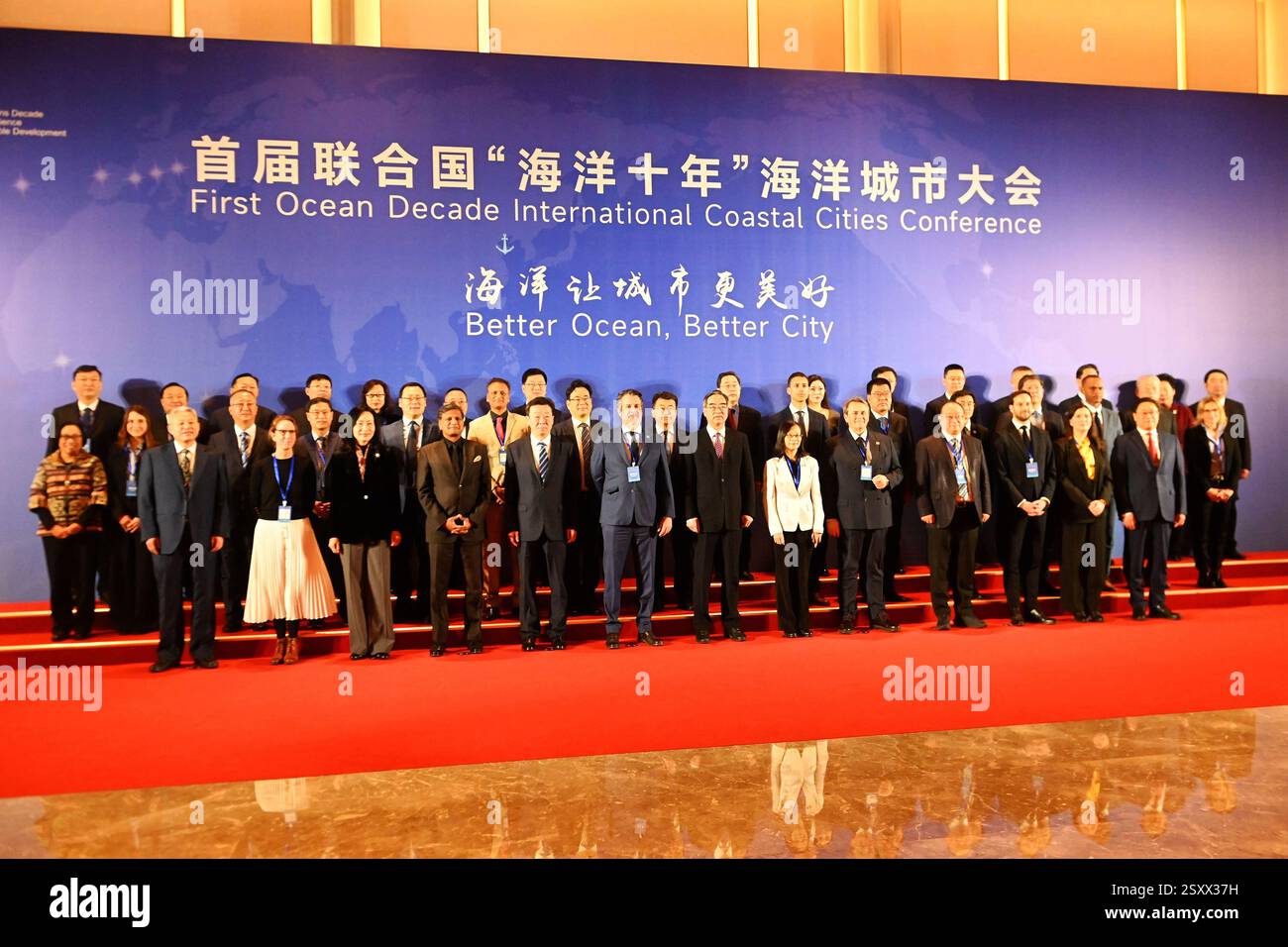 QINGDAO, CHINA - FEBRUARY 26, 2025 - Guests pose for a group photo in ...