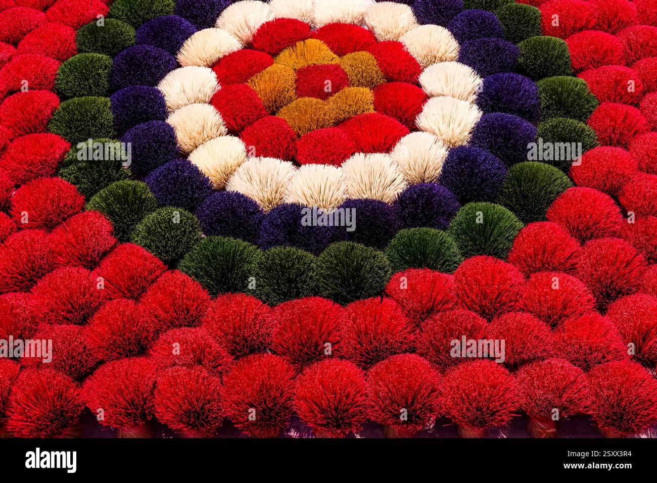 Dyed thin bamboo sticks in bundles in various colours for the ...