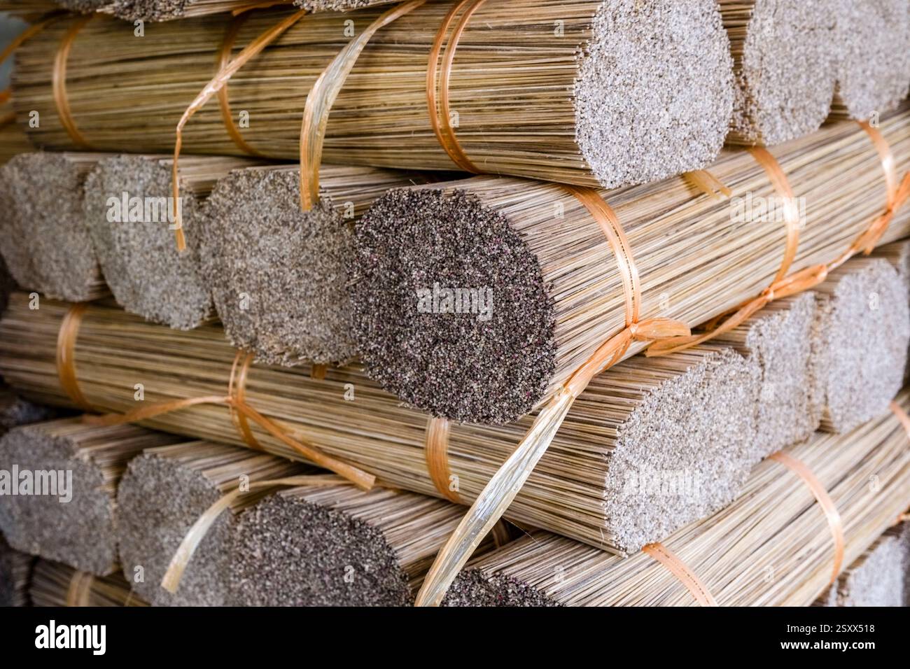 Stacked bundles of split thin bamboo sticks for the later production of ...