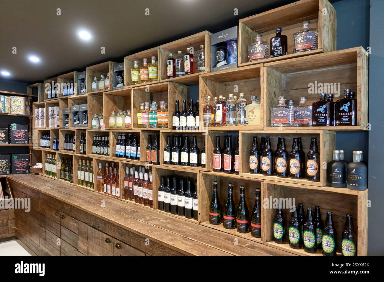 Bottles of alcohol lined up on shelves, England, UK Stock Photo - Alamy