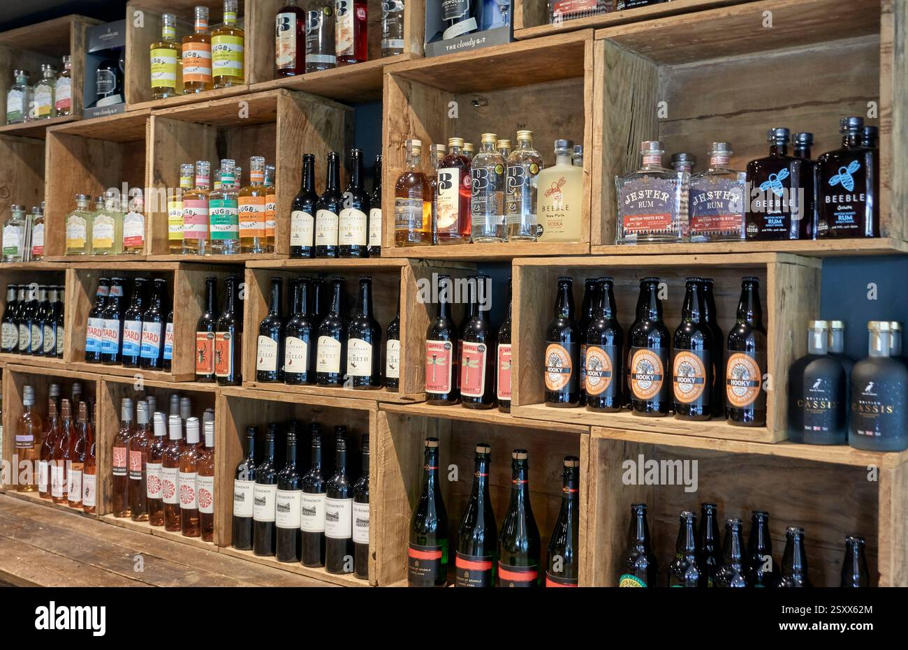 Bottles of alcohol lined up on shelves, England, UK Stock Photo - Alamy