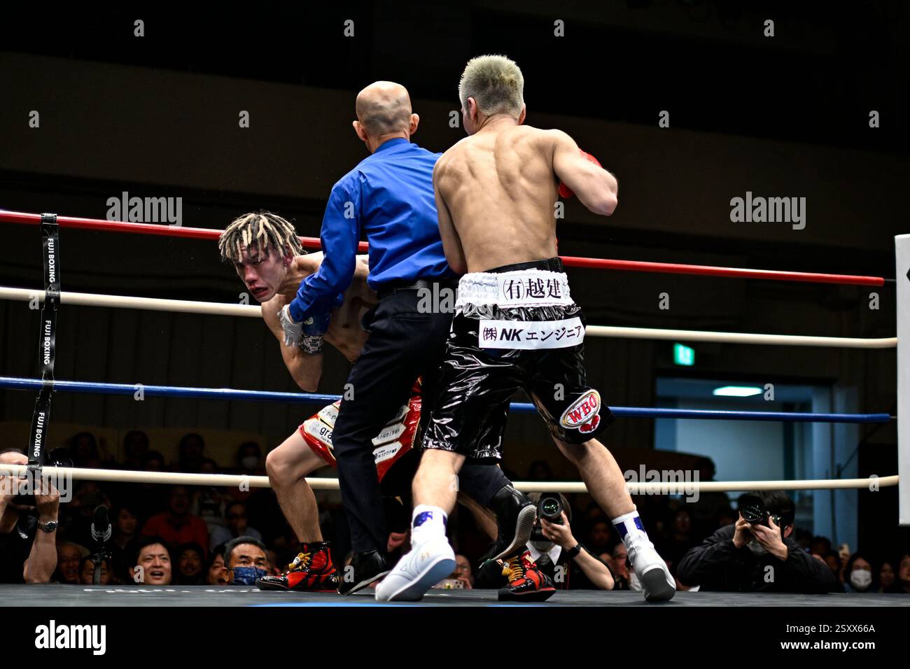 Tokyo, Japan. 11th Feb, 2025. Referee Koji Tanaka steps in between ...