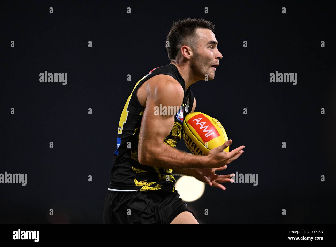 Melbourne, Australia. 26th Feb, 2025. Seth Campbell of Richmond marks ...