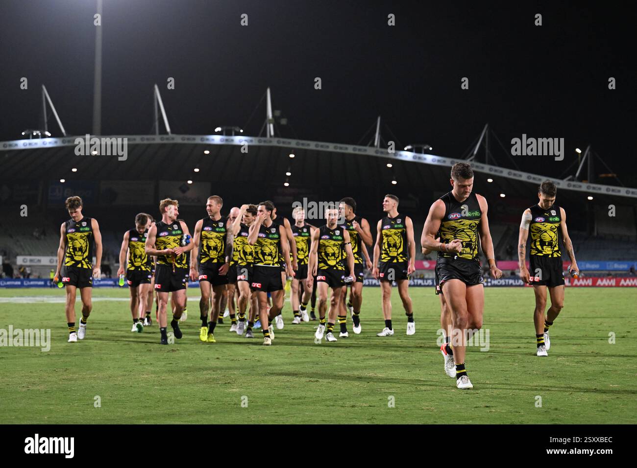 Richmond players exit the field after their loss to Collingwood in the ...