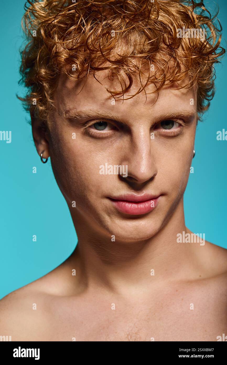 A young man with stunning curls confidently showcases his style against ...