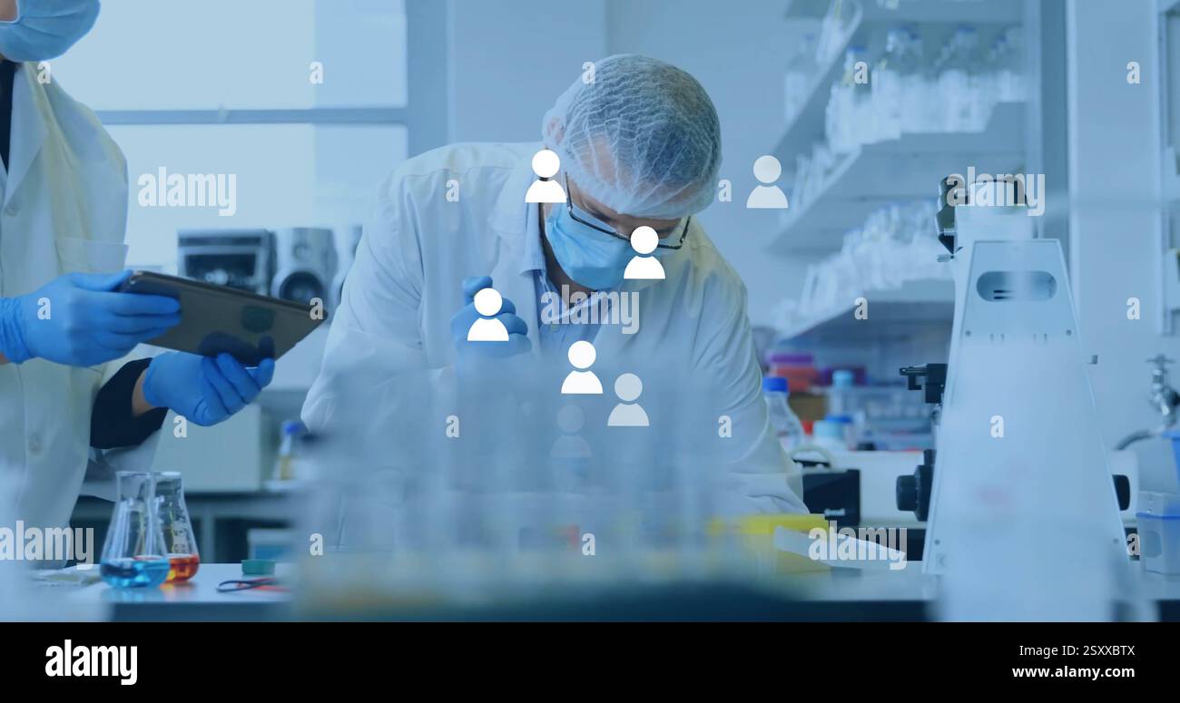 Image of media icons over diverse scientists doing experiments in lab ...