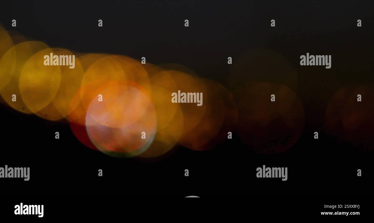 Image of light spots on black background Stock Photo - Alamy