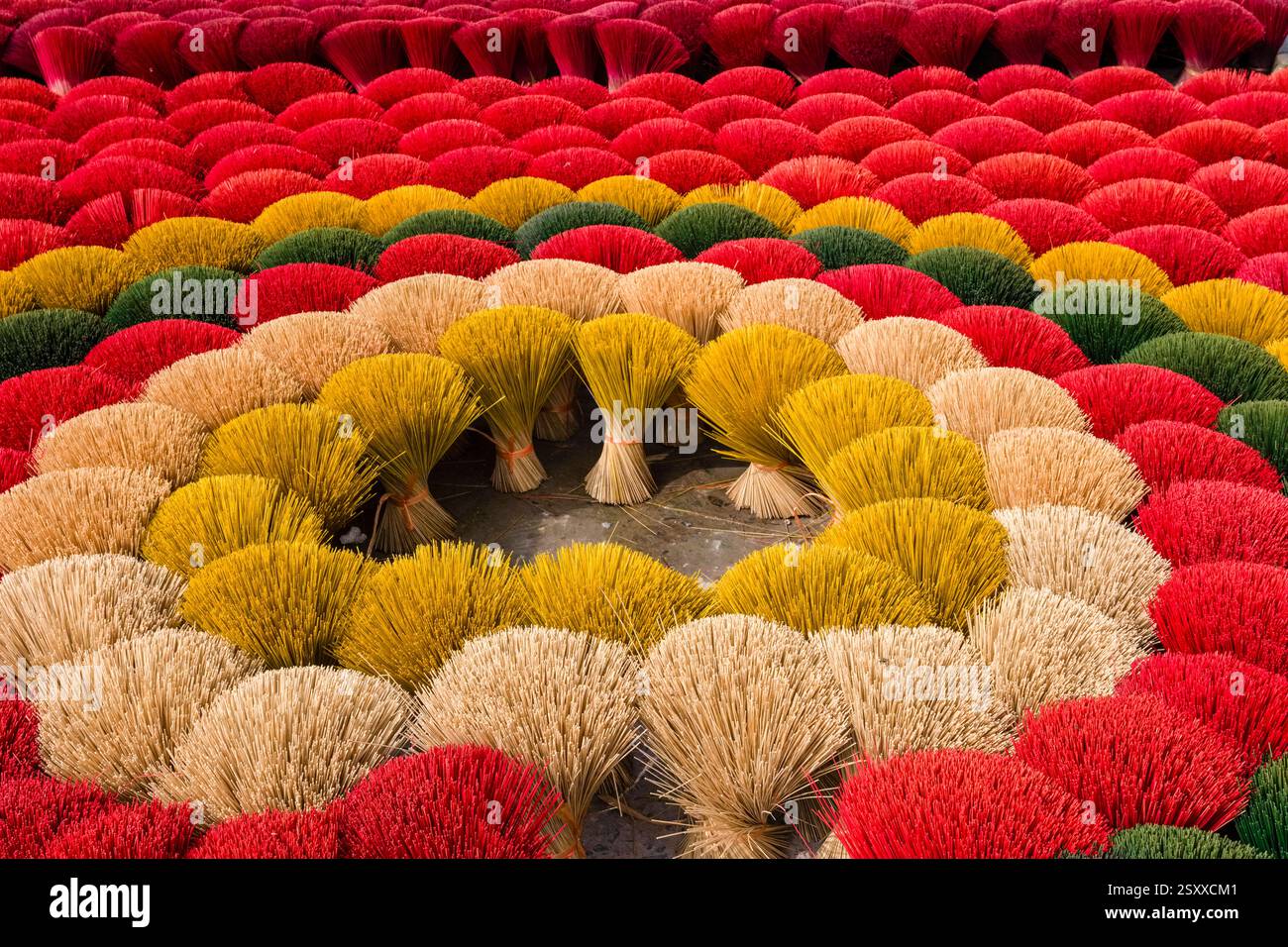 Dyed thin bamboo sticks in bundles in various colours for the ...