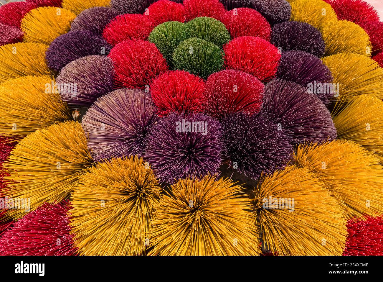 Dyed thin bamboo sticks in bundles in various colours for the ...