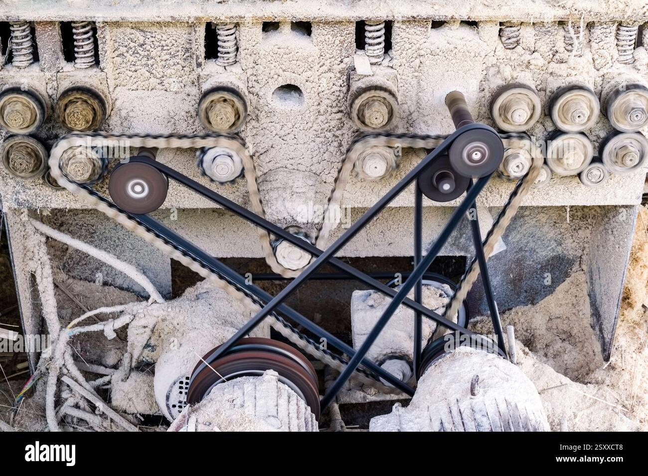 Completely dusty drive belts and chains of a machine for splitting ...