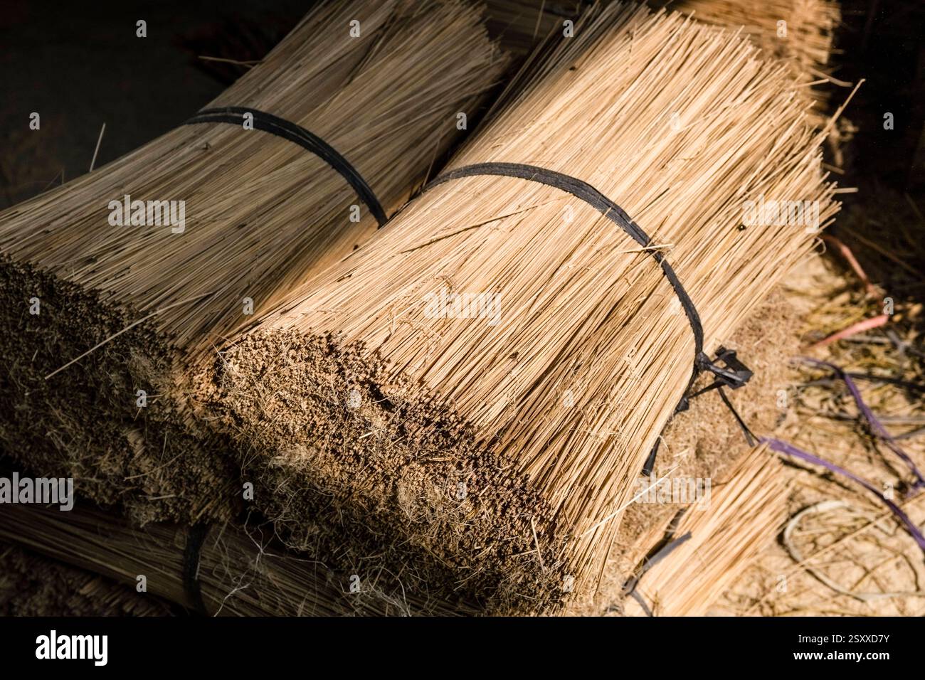 Stacked bundles of split thin bamboo sticks for the later production of ...